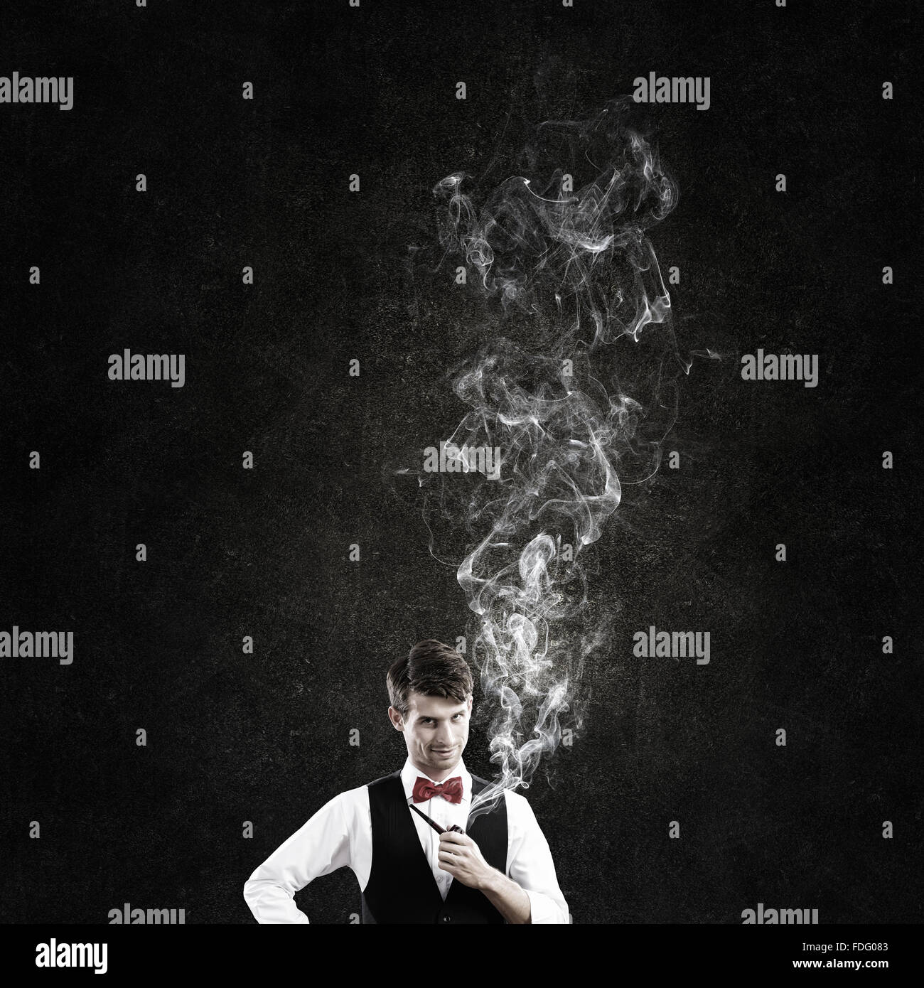 Handsome young businessman thinking over ideas and smoking pipe Stock ...