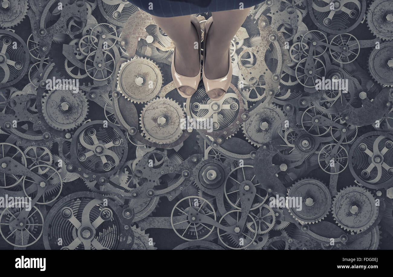 Top view of businesswoman standing on floor of gears Stock Photo - Alamy