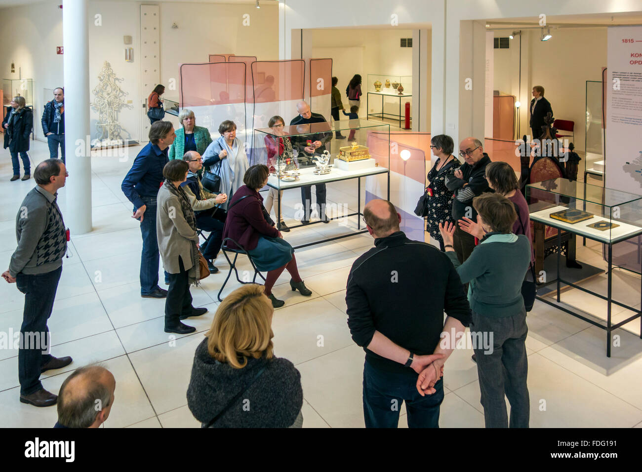 Visitors during guided tour in the Design Museum Gent in the city Ghent ...