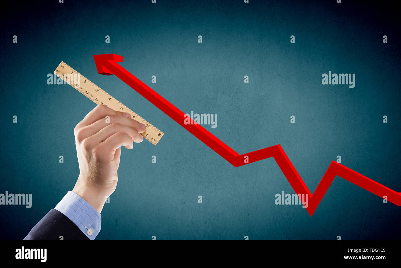 Close up of male hand measuring graph with ruler Stock Photo - Alamy