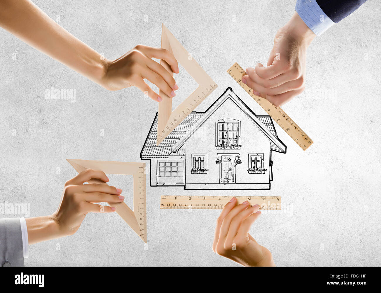 Close up of people hands measuring house model with ruler Stock Photo ...