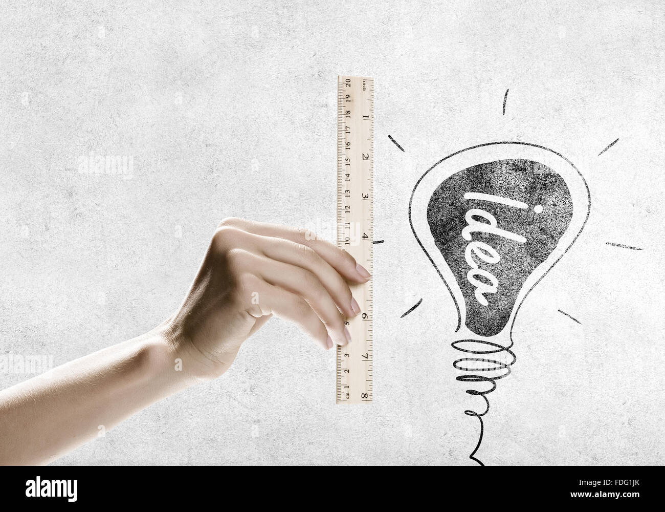 Close up of people hands measuring ight bulb with ruler Stock Photo - Alamy