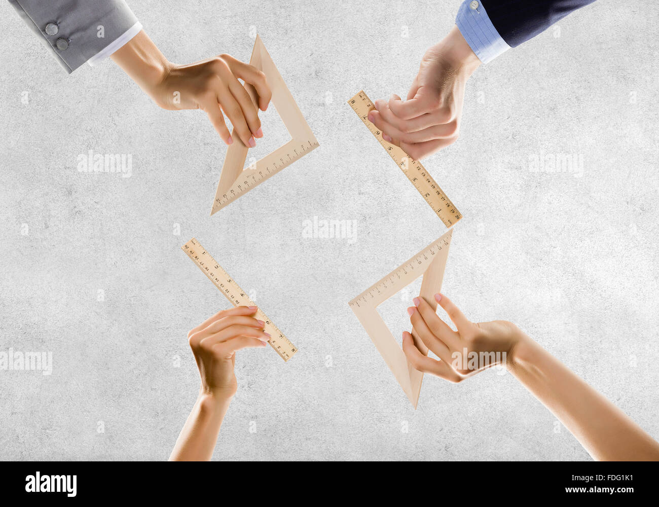 Close up of hand measuring with wooden ruler Stock Photo - Alamy