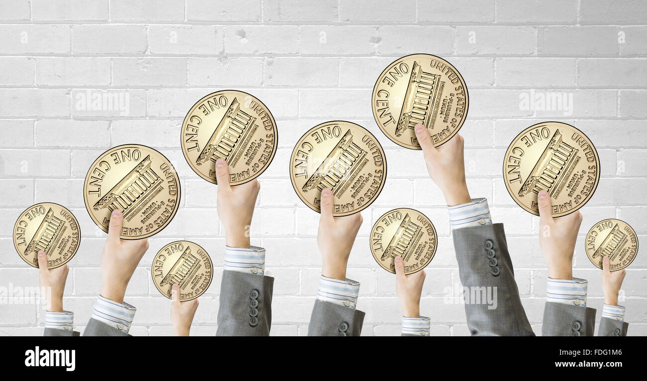 Crowd of people holding one cent coin Stock Photo - Alamy