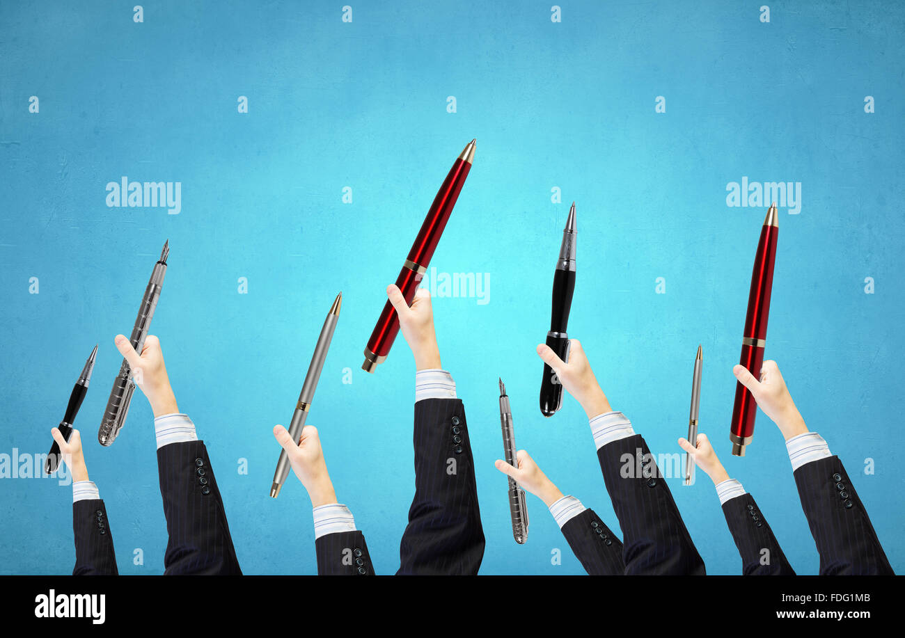 Many hands of business people holding automatic pen Stock Photo - Alamy