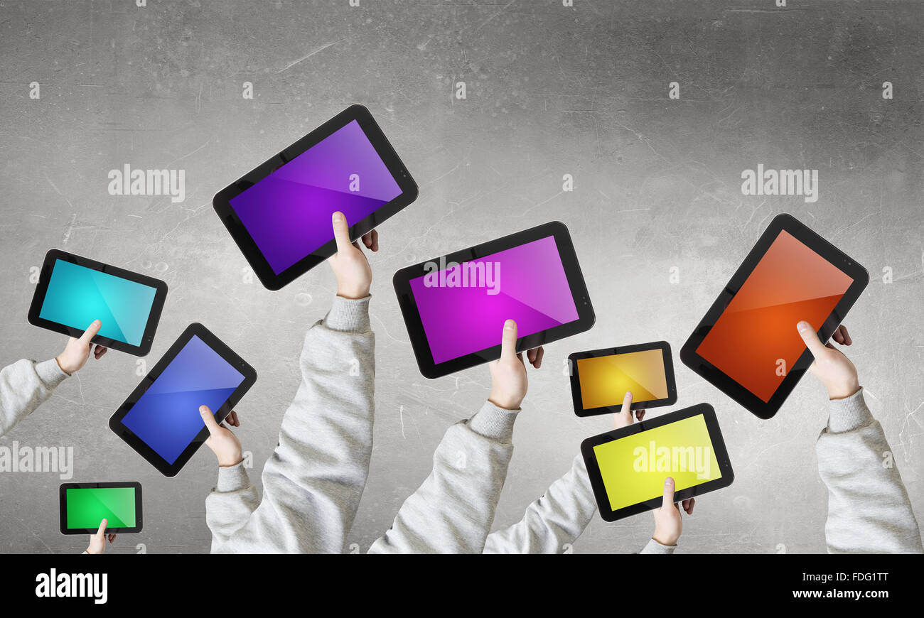 Team of business people holding tablets in hands Stock Photo - Alamy