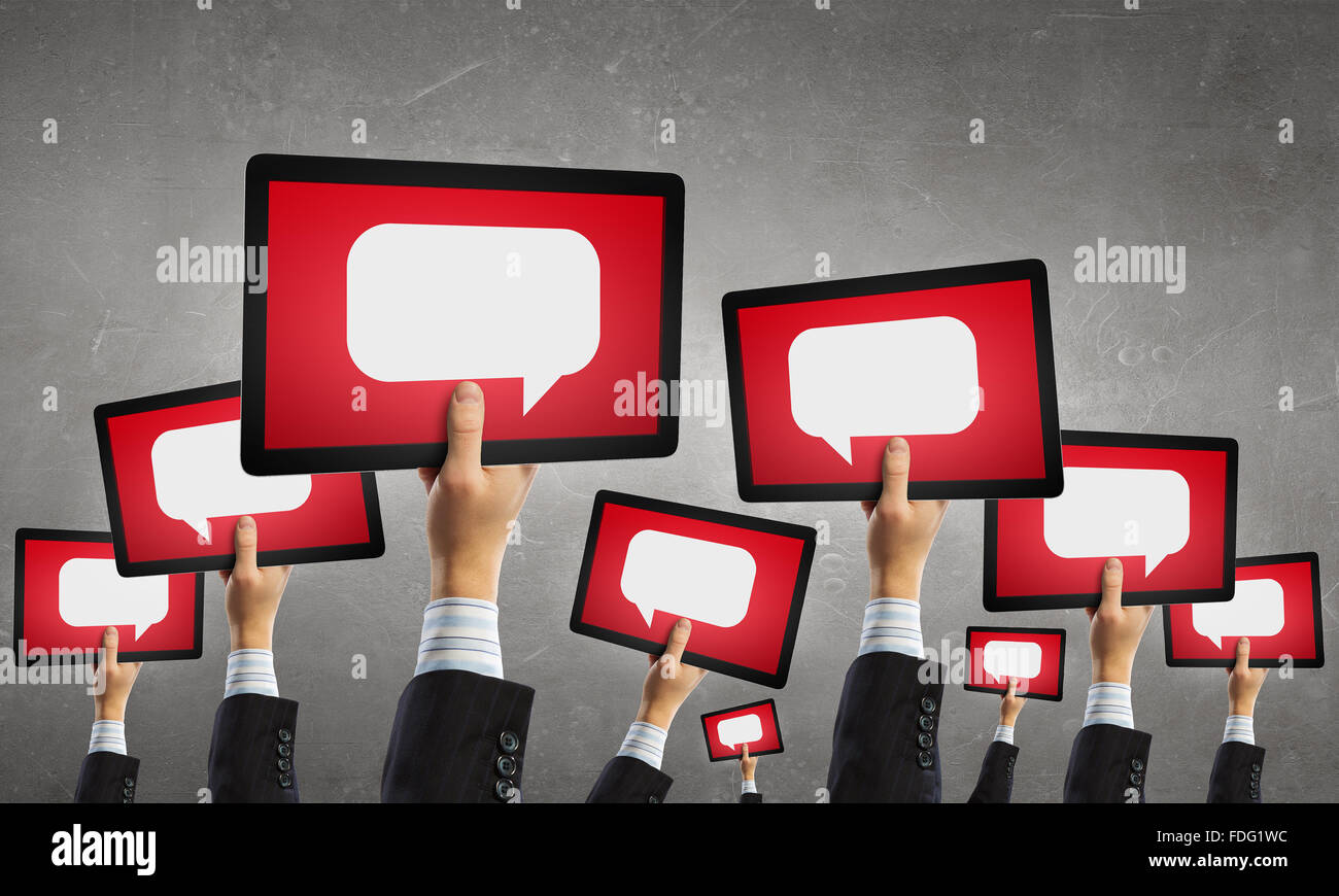 Team of business people holding tablets in hands Stock Photo - Alamy