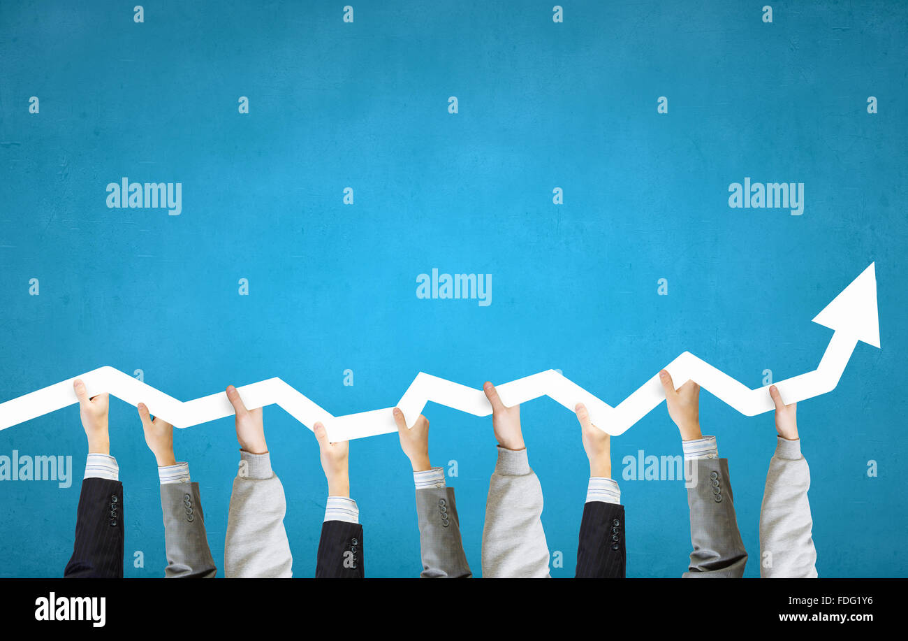 Group of business people holding growing graph in raised hands Stock ...