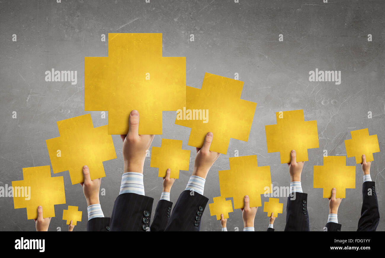 Holding hands and plus sign hi-res stock photography and images - Alamy