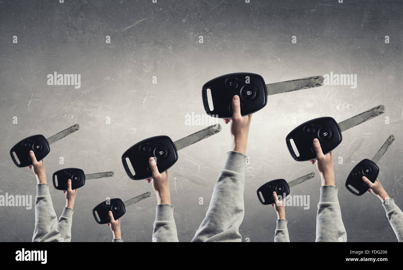 Many hands of business people holding keys Stock Photo - Alamy