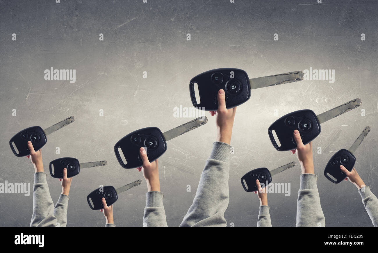Many hands of business people holding keys Stock Photo - Alamy