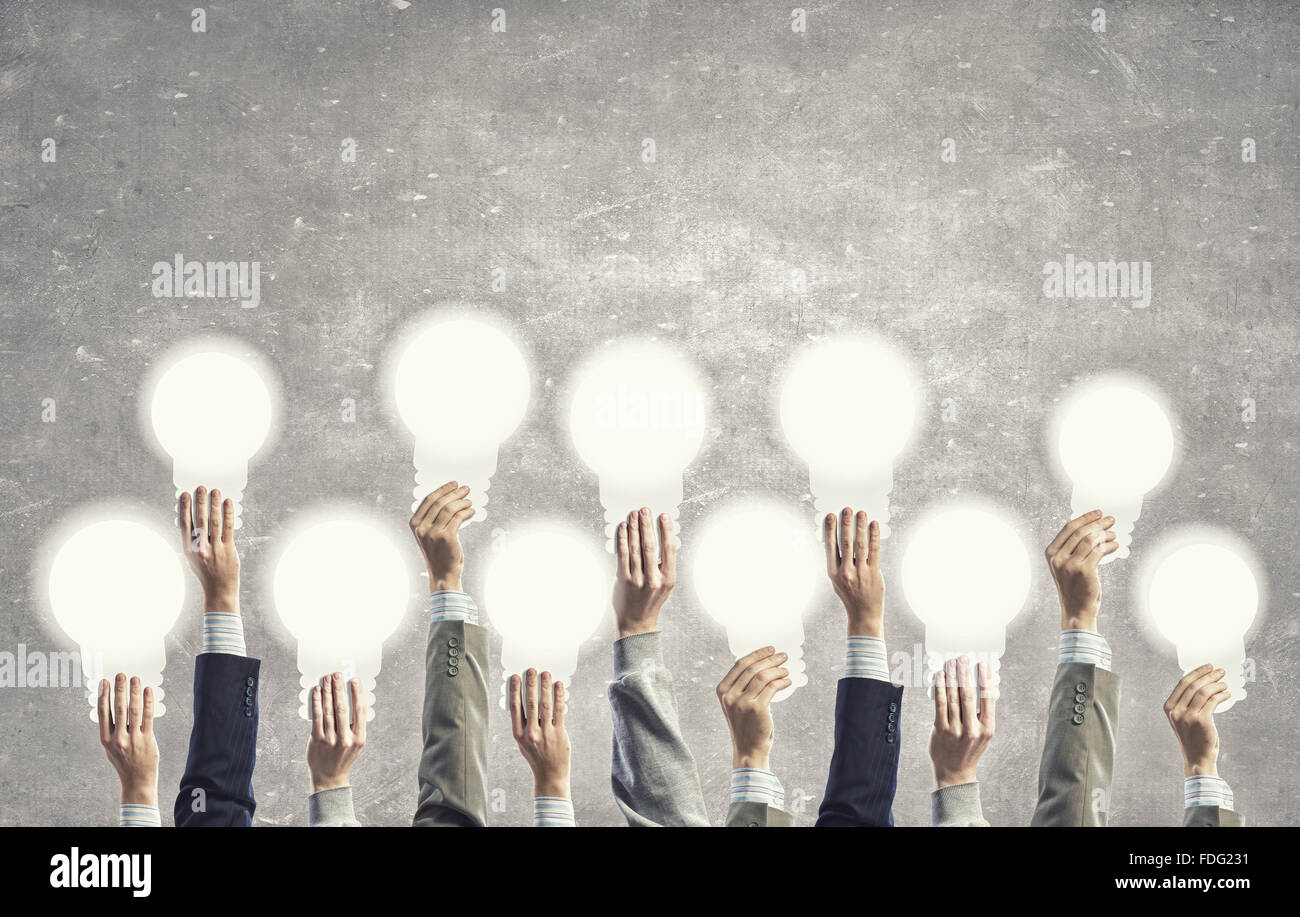 Many hands bulb hi-res stock photography and images - Alamy