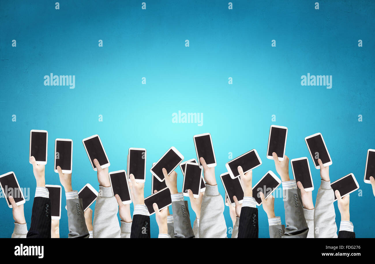 Team of business people holding tablets in hands Stock Photo - Alamy
