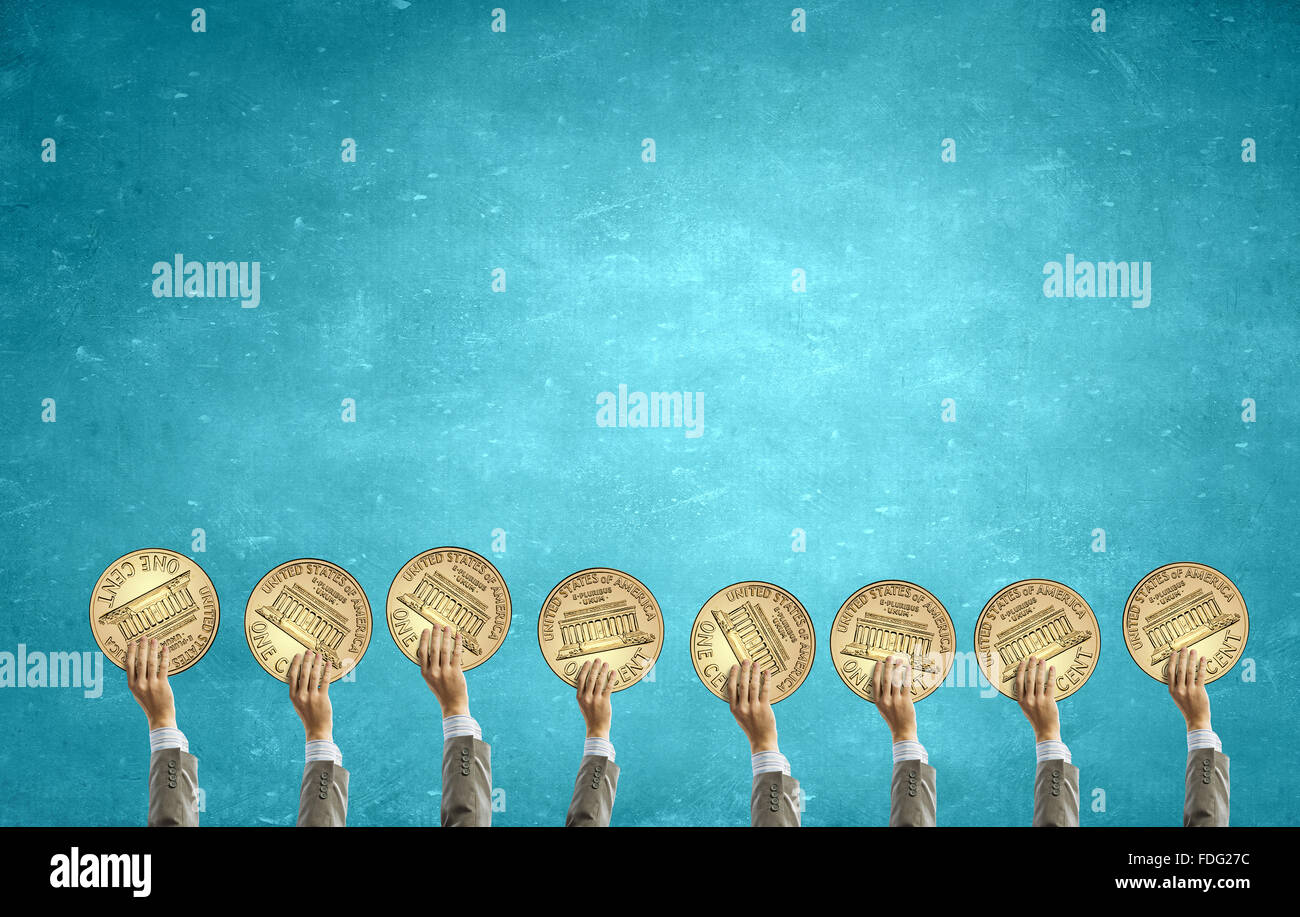 Crowd of people holding one cent coin Stock Photo - Alamy