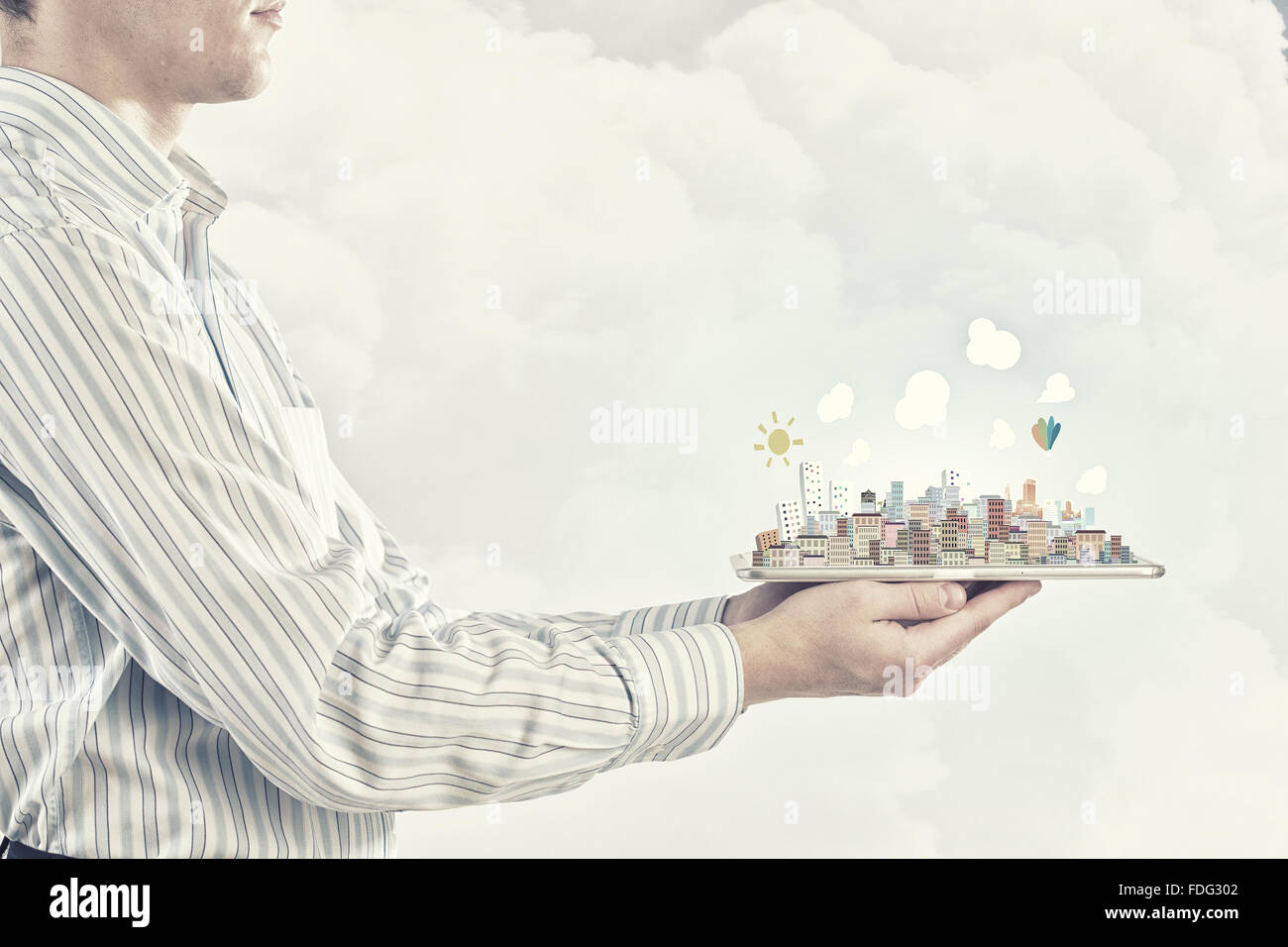 Hand holding tablet computer with cityscape on screen Stock Photo - Alamy