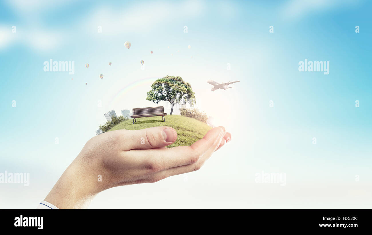 Close up of hand holding green tree concept Stock Photo - Alamy