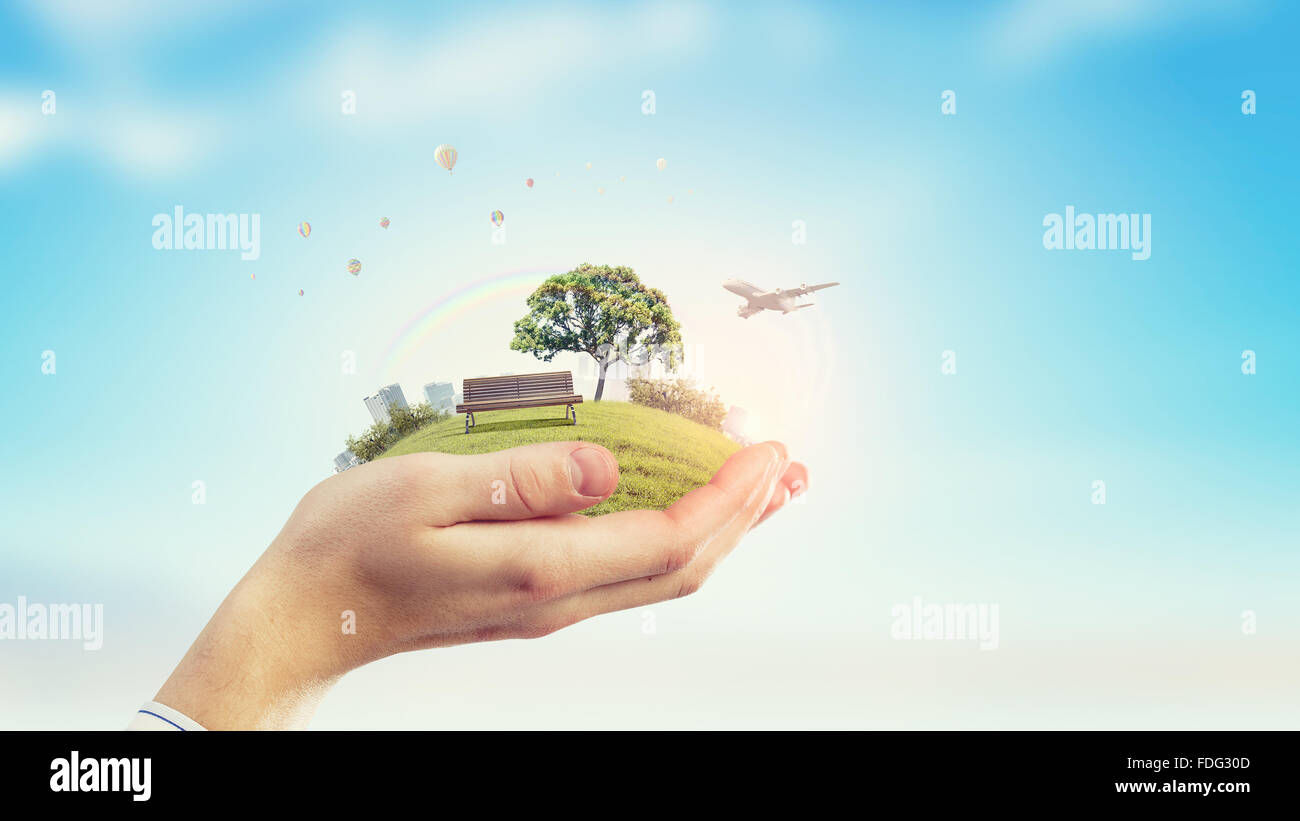 Close up of hand holding green tree concept Stock Photo - Alamy