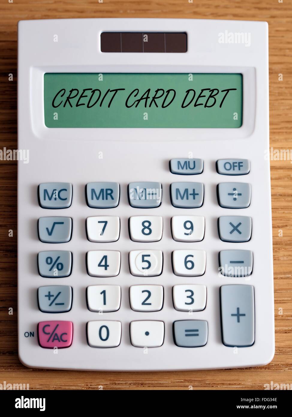 Credit card debt on a calculator screen Stock Photo - Alamy