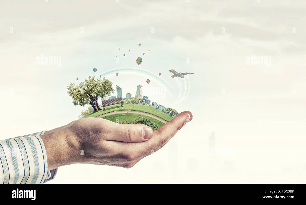 Close up of hand holding green tree concept Stock Photo - Alamy