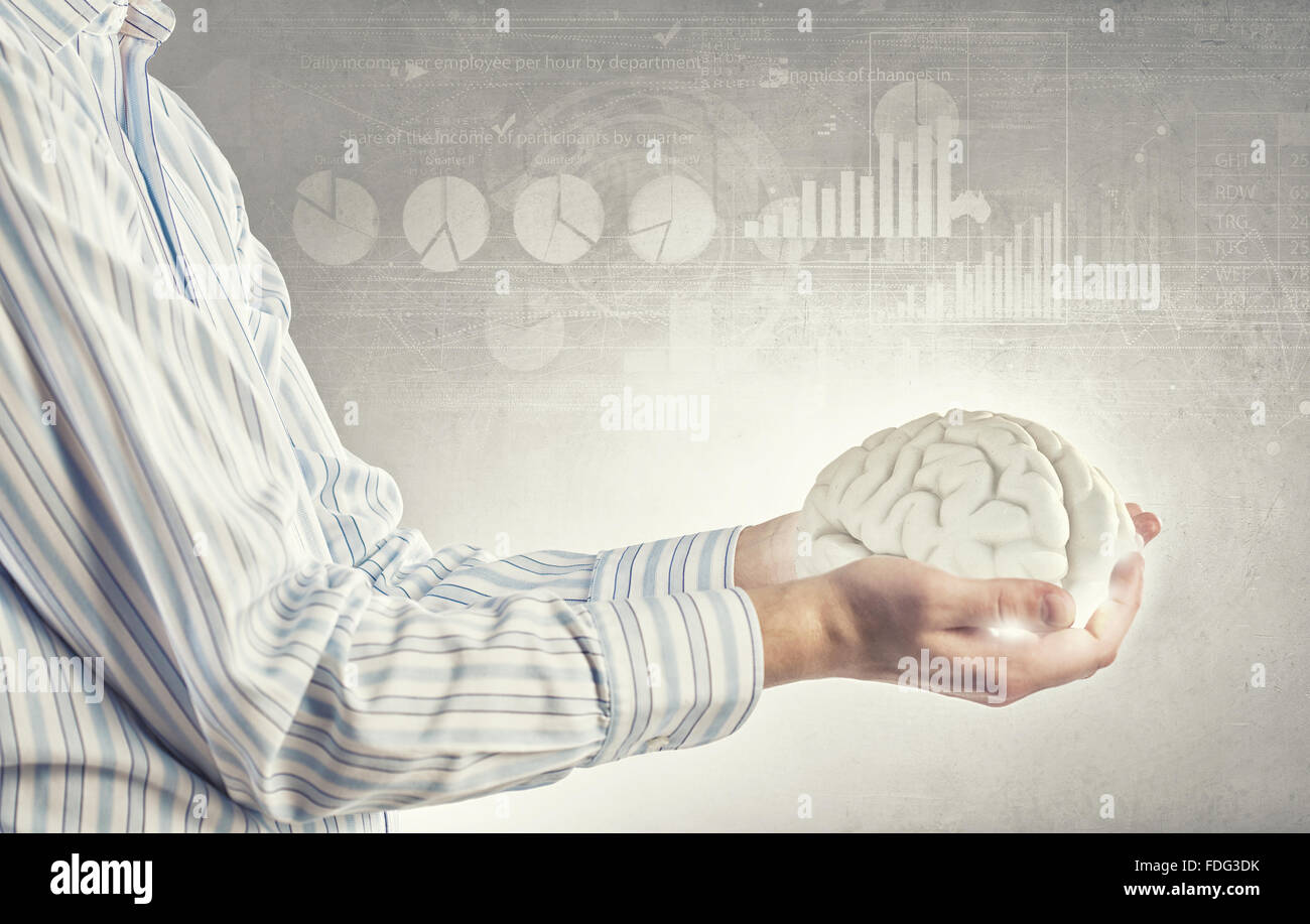 Close up of human hand holding brain Stock Photo - Alamy