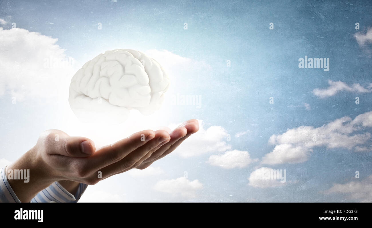 Close up of human hand holding brain Stock Photo - Alamy