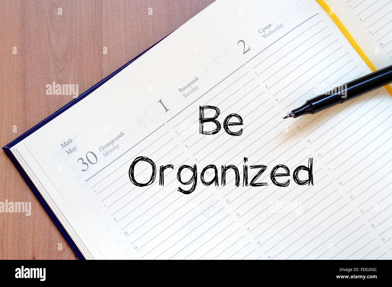 Be organized text concept write on notebook with pen Stock Photo - Alamy