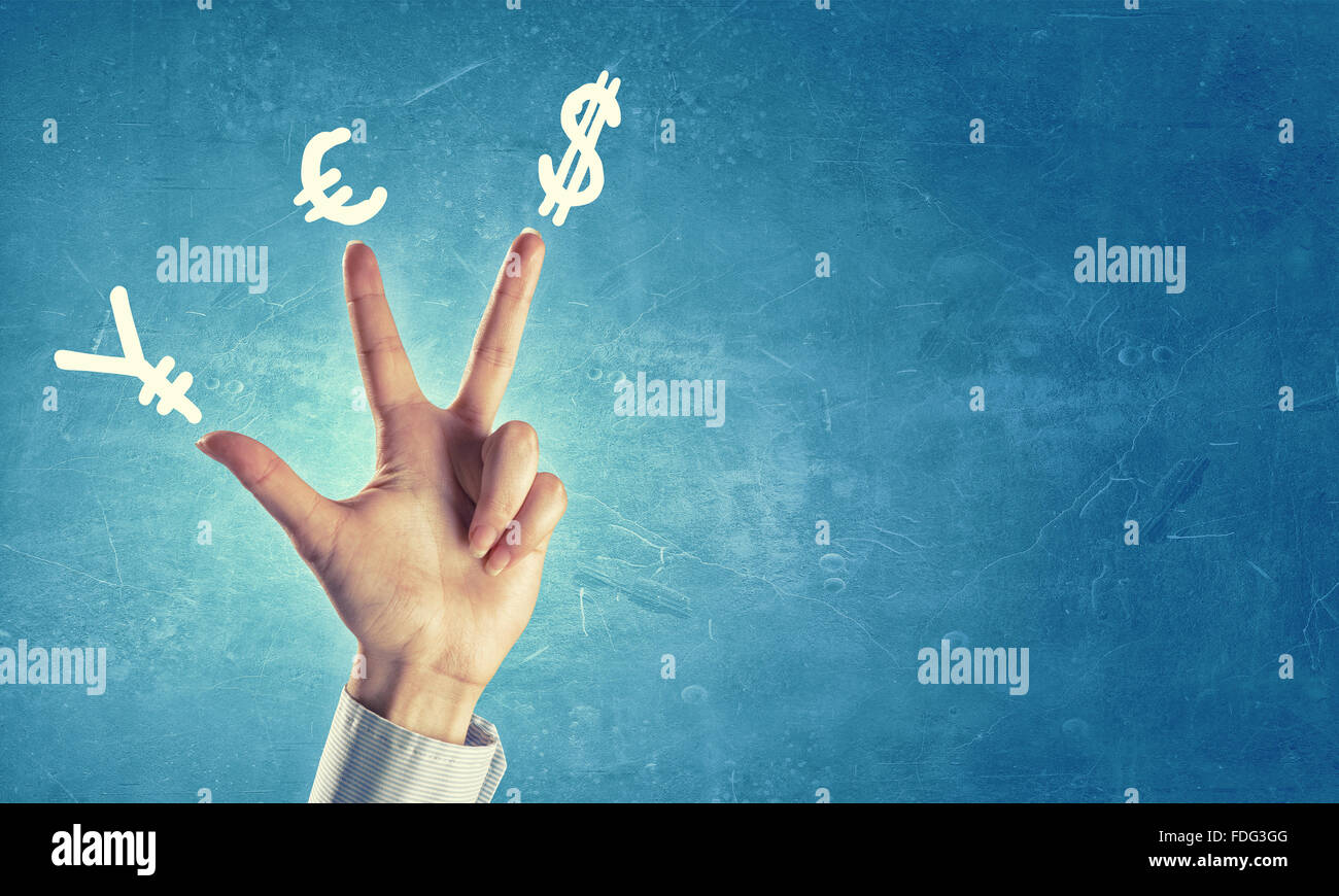Hands and money currency signs on fingers Stock Photo - Alamy