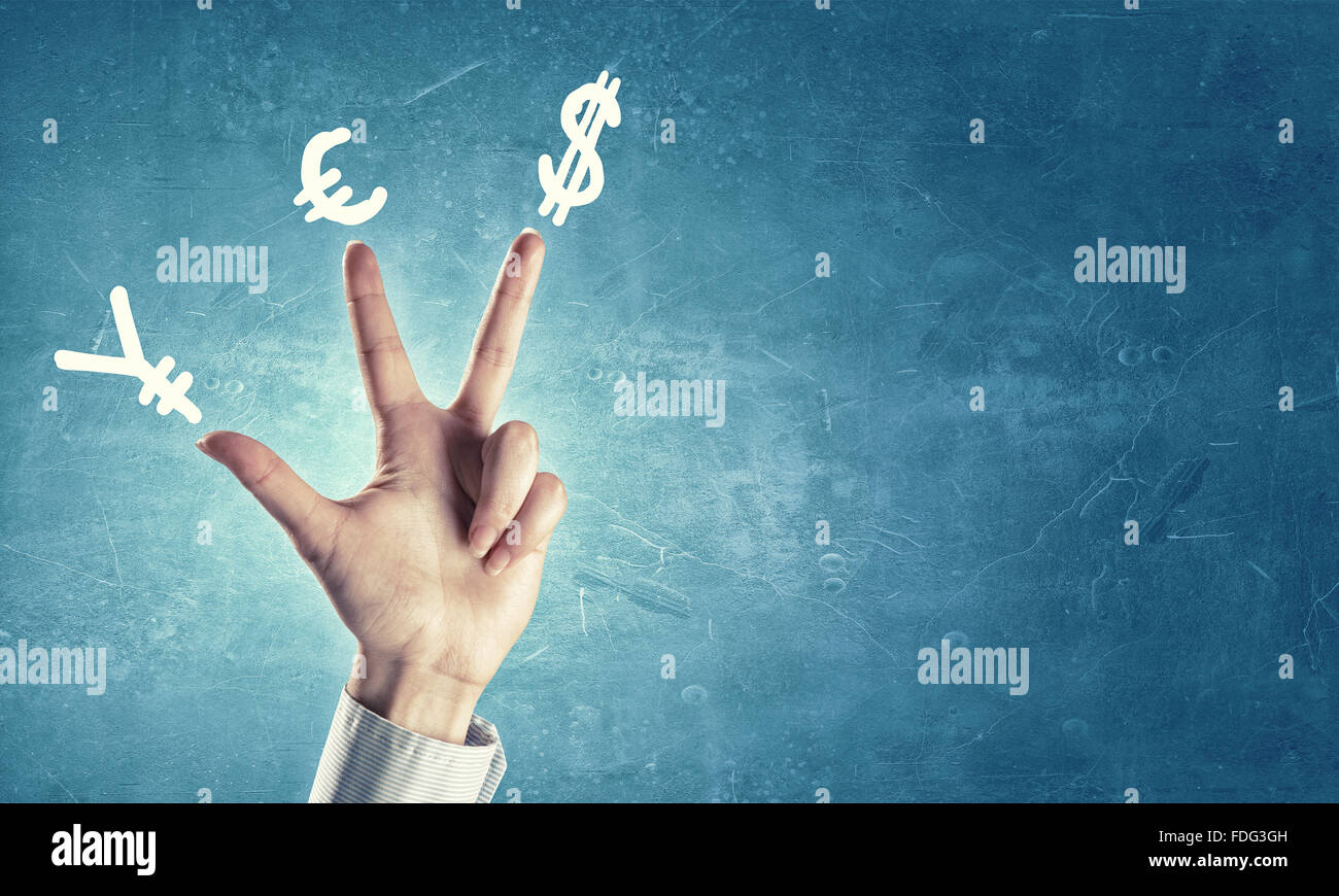 Hands and money currency signs on fingers Stock Photo - Alamy
