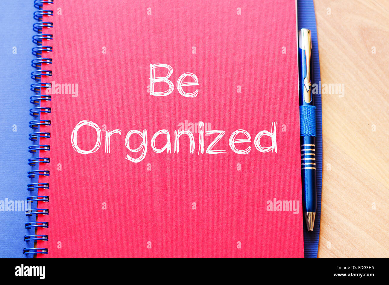 Be organized text concept write on notebook with pen Stock Photo - Alamy
