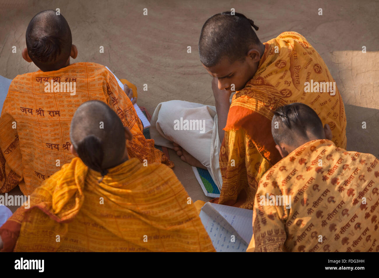 Four Hindu boys studying for the priesthood Stock Photo - Alamy