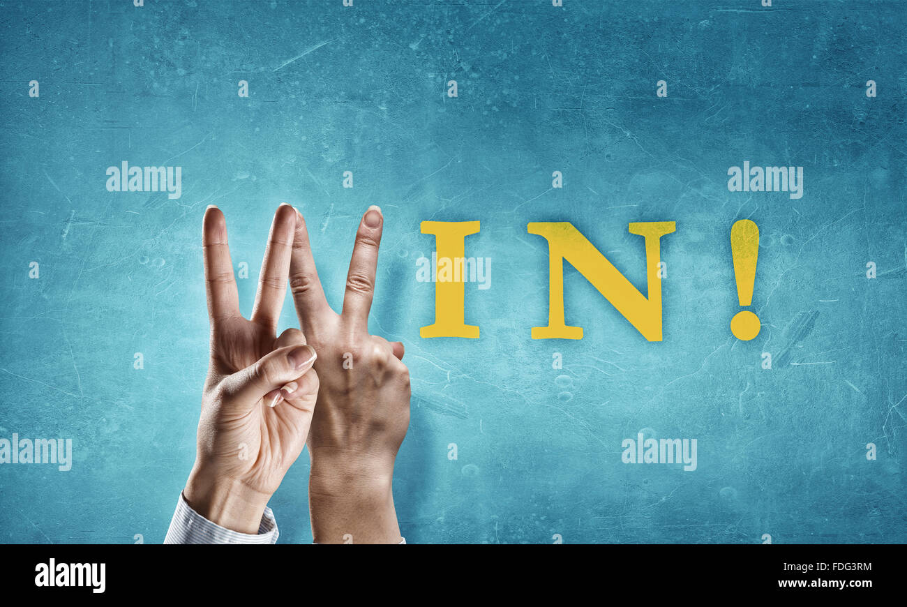 Word WIN with fingers instead of letter W Stock Photo - Alamy