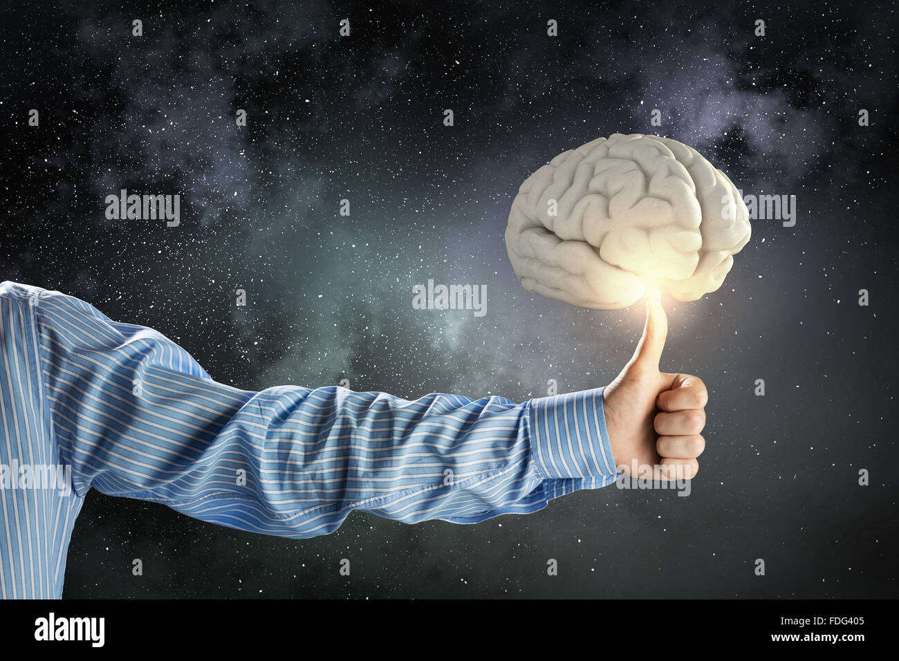 Close up of businessman hand showing thumb up to brain Stock Photo - Alamy
