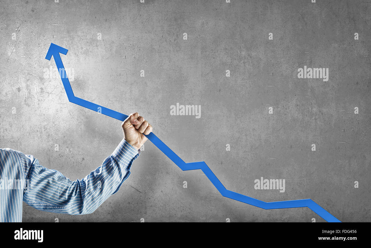 Hand showing power concept and growing graph Stock Photo - Alamy