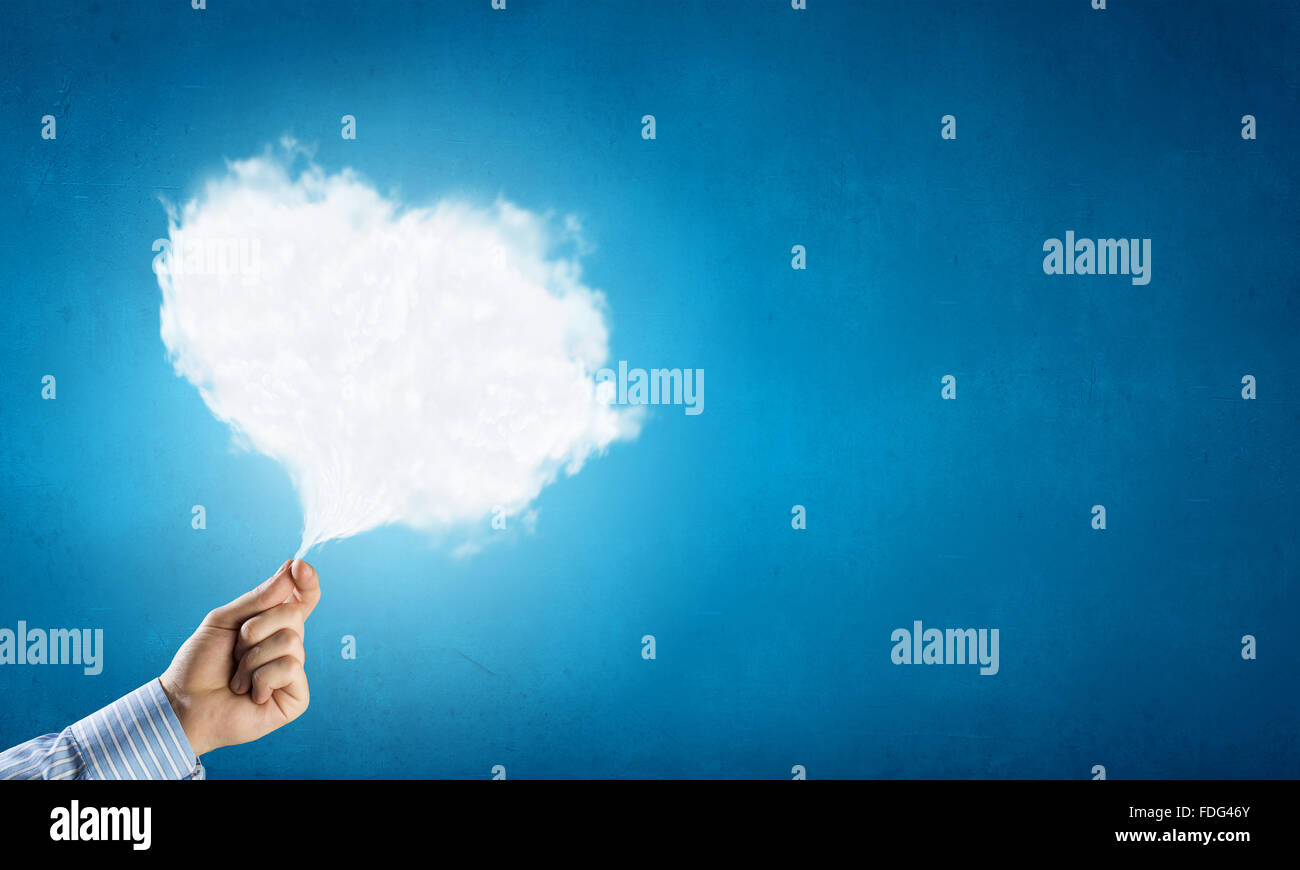 Close up of hand catching edge of white cloud Stock Photo - Alamy