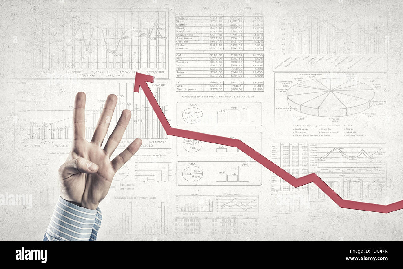 Businessman hand showing gesture and red growing graph Stock Photo - Alamy