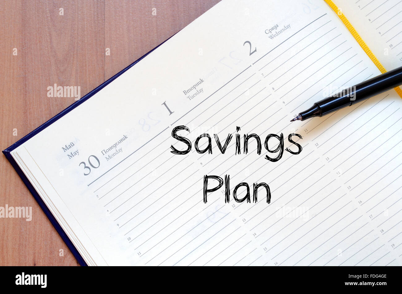 Savings plan text concept write on notebook with pen Stock Photo - Alamy