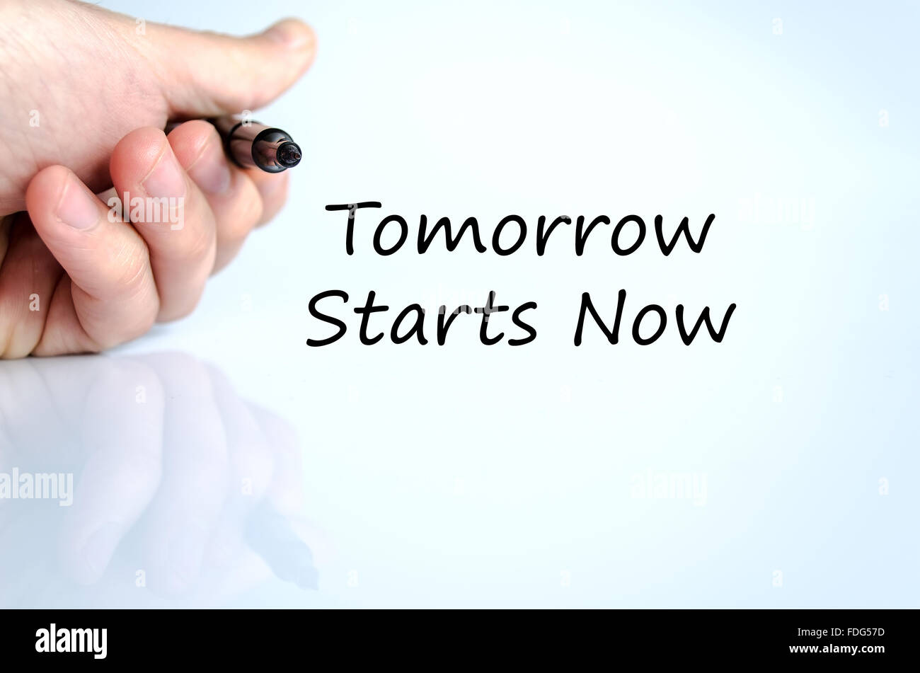 Tomorrow starts now text concept isolated over white background Stock ...