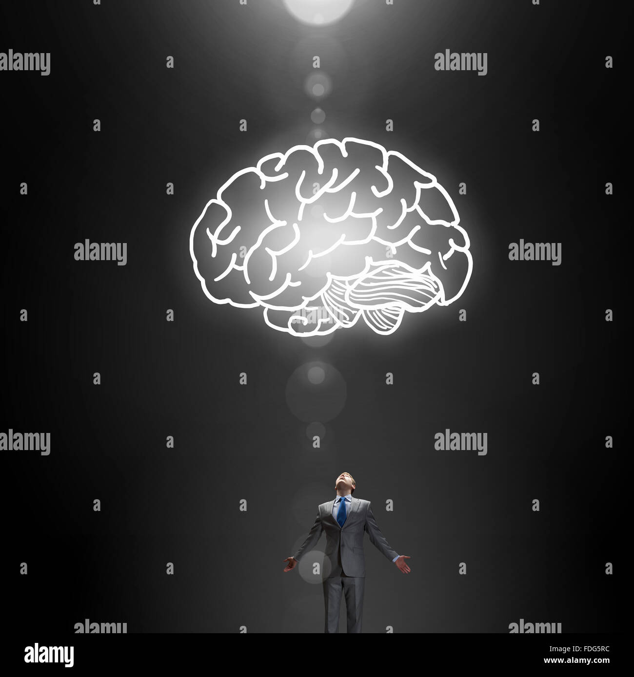 Businessman with hands spread wide and human brain above his head Stock ...