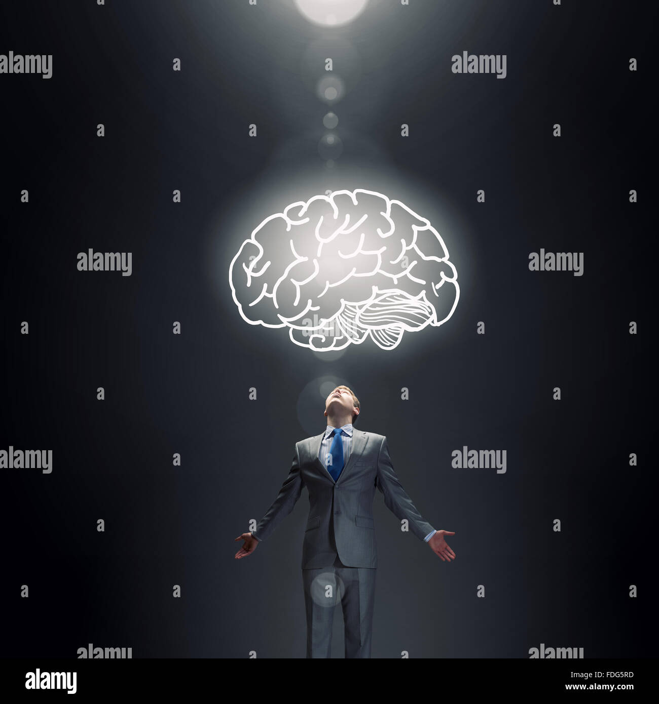 Businessman with hands spread wide and human brain above his head Stock ...