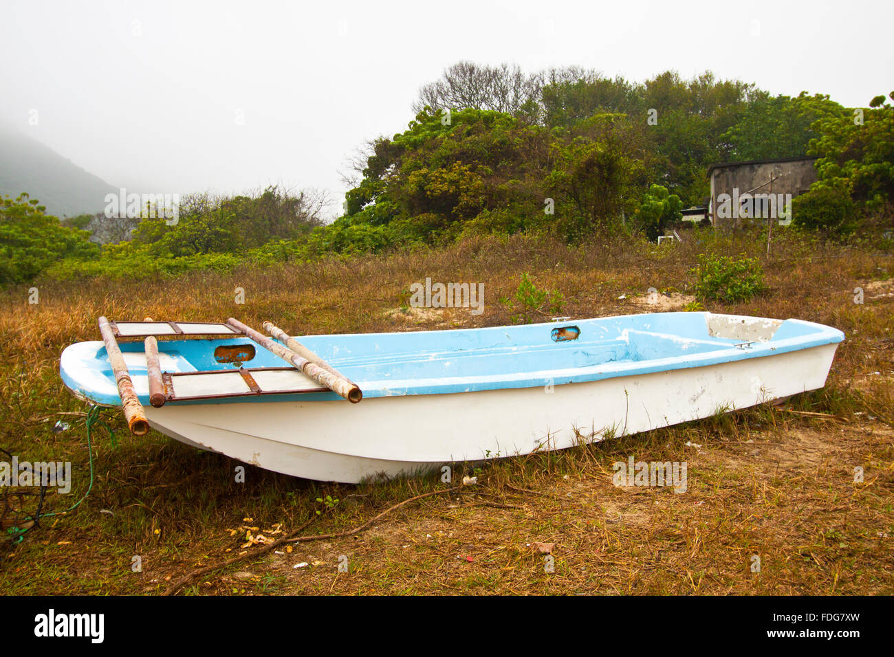 Single boat on the ground Stock Photo - Alamy
