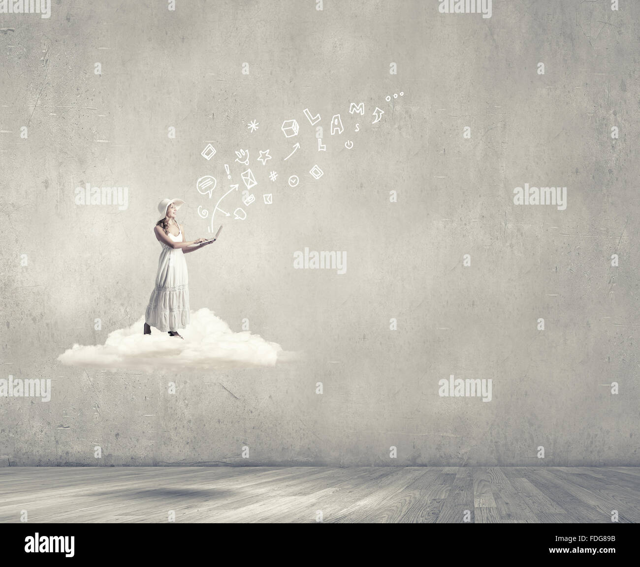 Young lady standing on cloud and using laptop Stock Photo - Alamy
