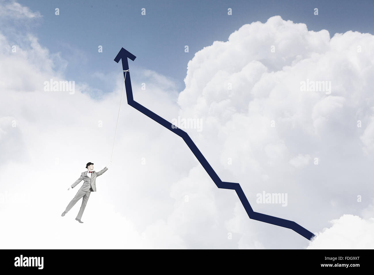 Businessman pulling arrow with rope and making it raise up Stock Photo ...