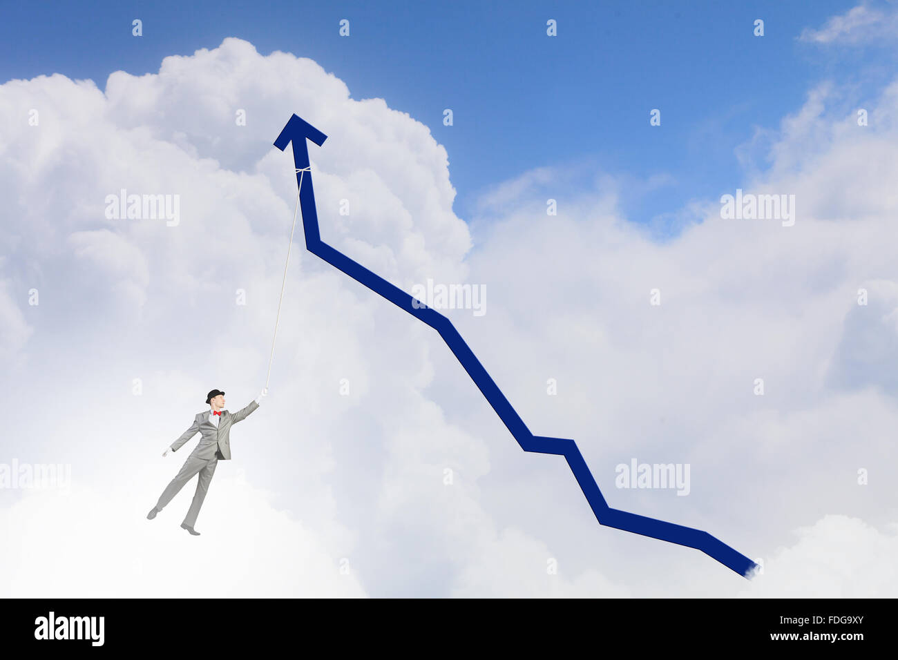 Businessman pulling arrow with rope and making it raise up Stock Photo ...