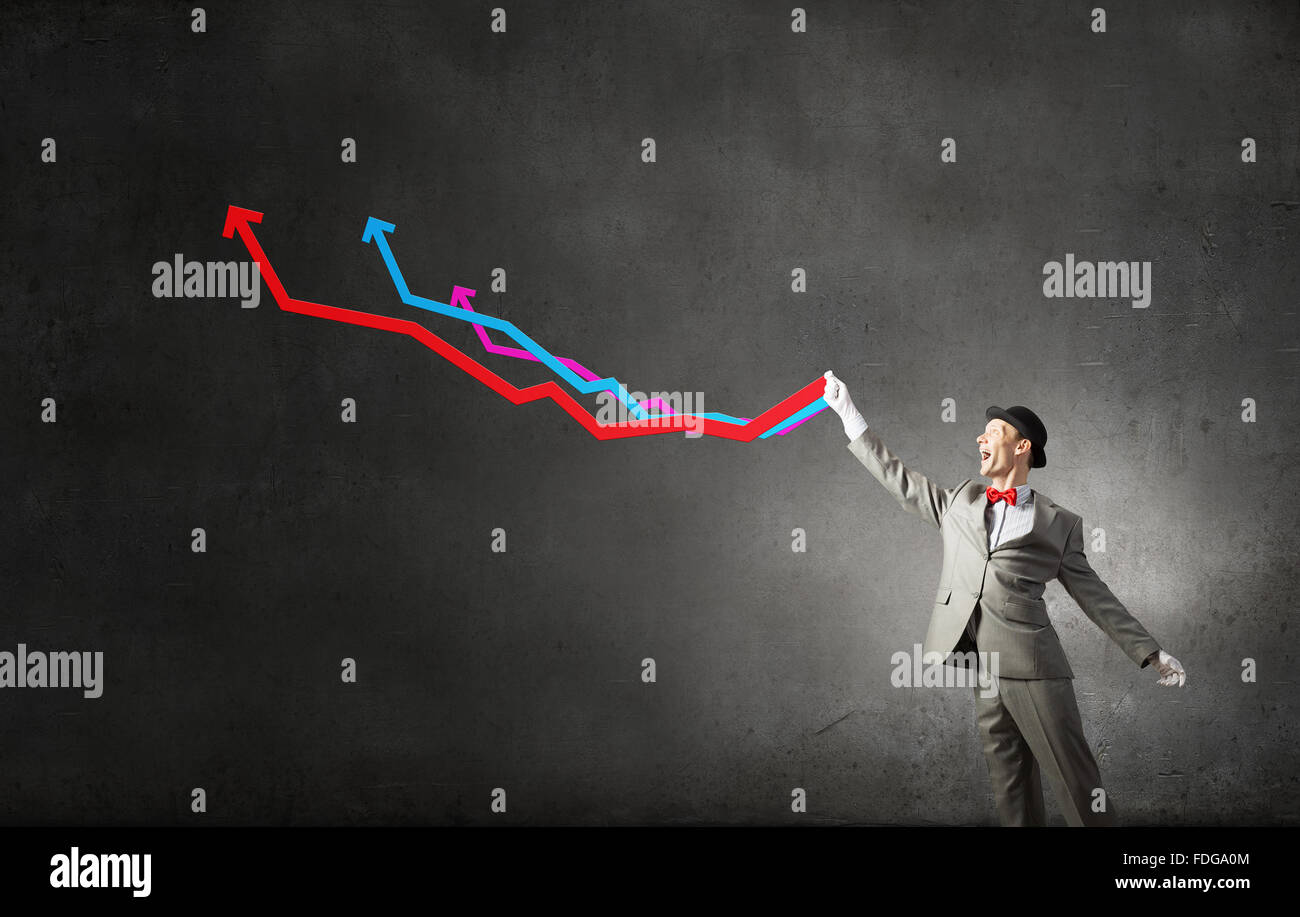 Businessman pulling arrow with rope and making it raise up Stock Photo ...