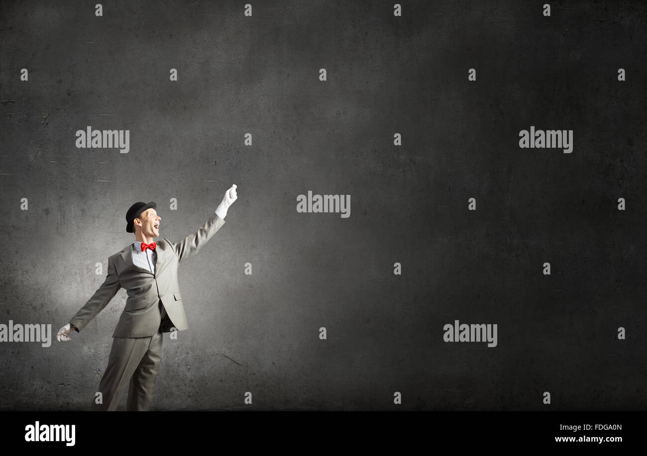 Businessman pulling arrow with rope and making it raise up Stock Photo ...