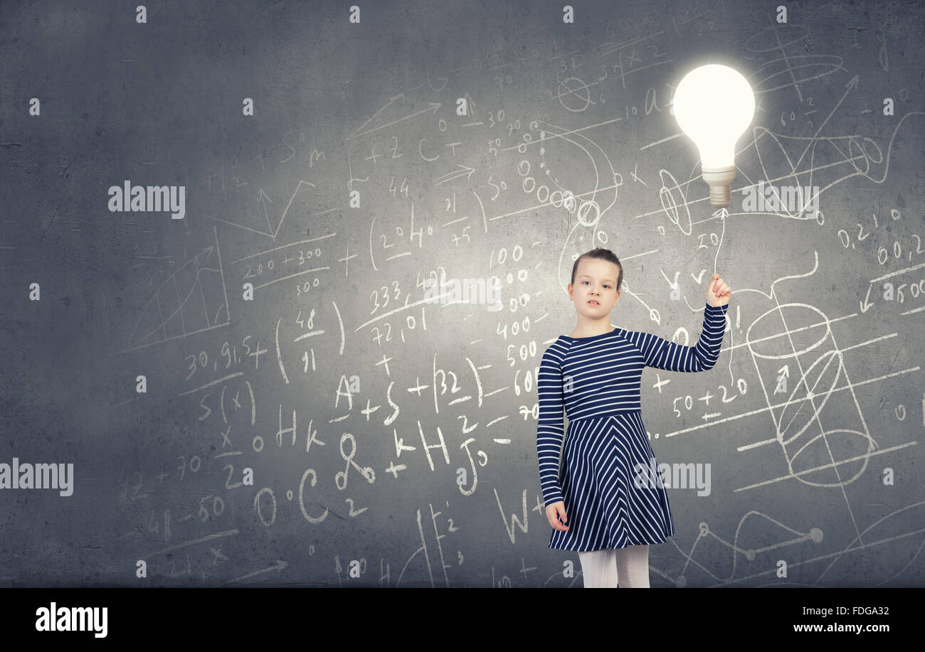 Cute girl of school age and blackboard on background Stock Photo - Alamy