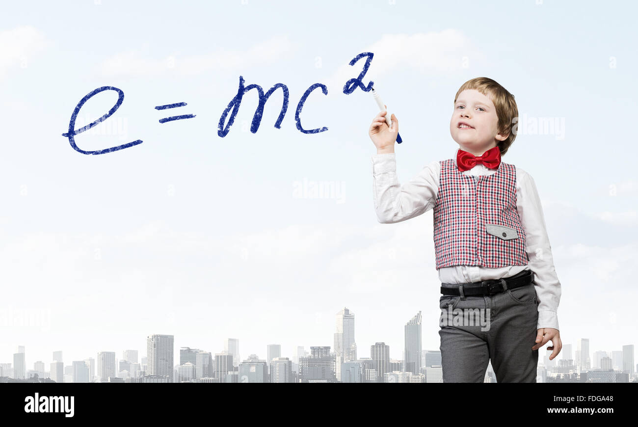 Cute boy drawing science formula on screen Stock Photo - Alamy
