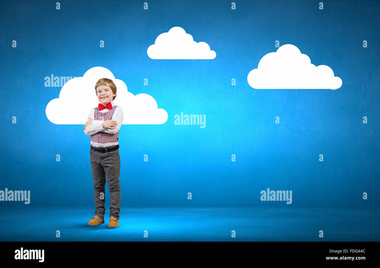 Portrait of little boy with hands folded on chest Stock Photo - Alamy