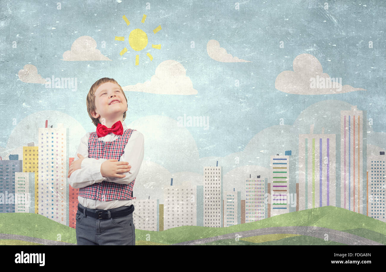 Portrait of little boy with hands folded on chest Stock Photo - Alamy