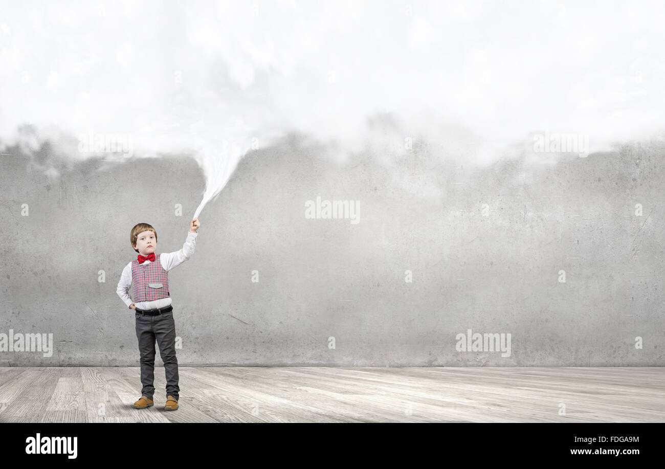 Adorable little cute boy catching blank cloud Stock Photo - Alamy